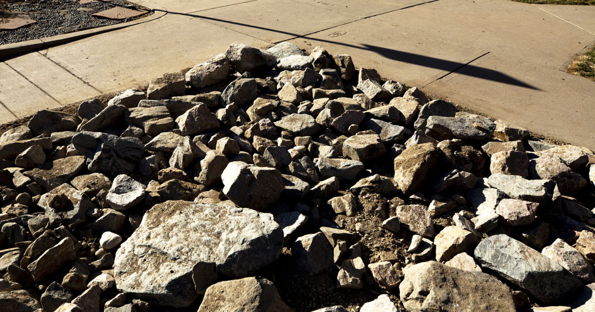 On a Five Points corner, jagged rocks, chunks of concrete, and a ...