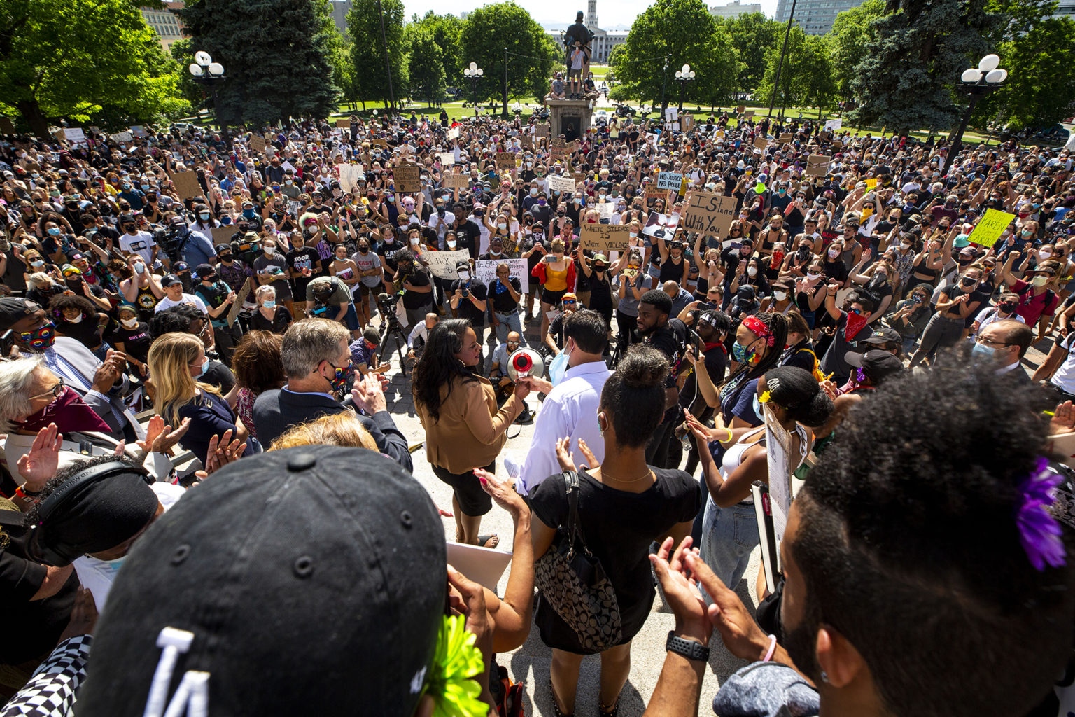 Huge crowd marches through Denver as protests prompt legislative action ...