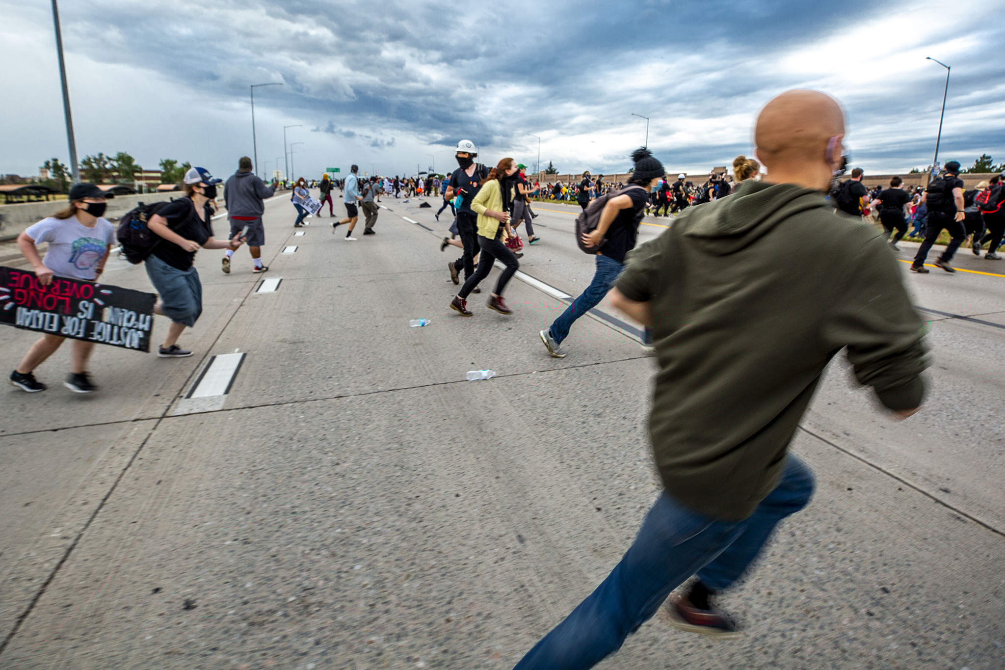 Driver speeds through protesters on I-225 during rally for justice for ...