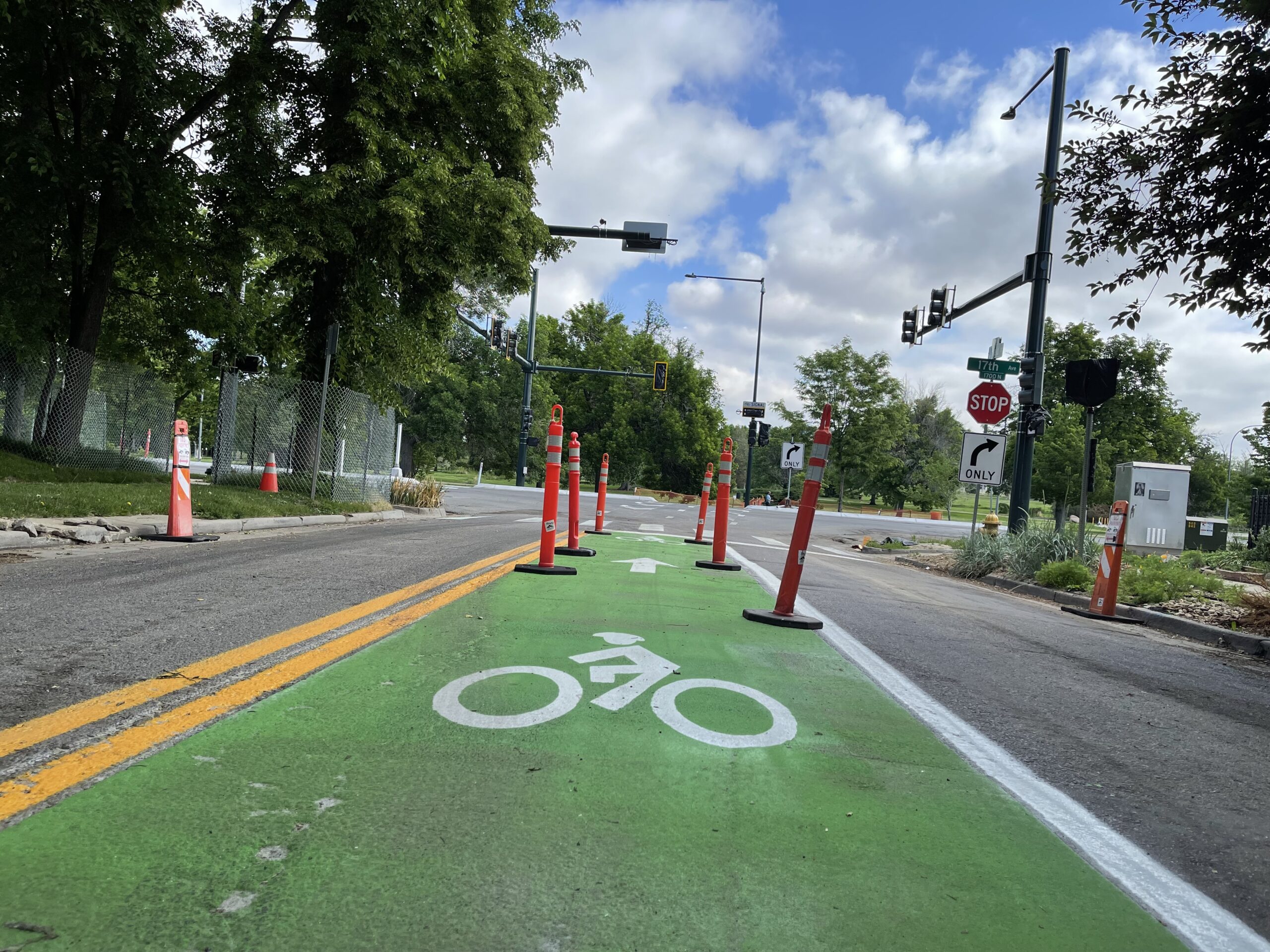 Crews are working to install protected bike lanes on Blake and Market ...