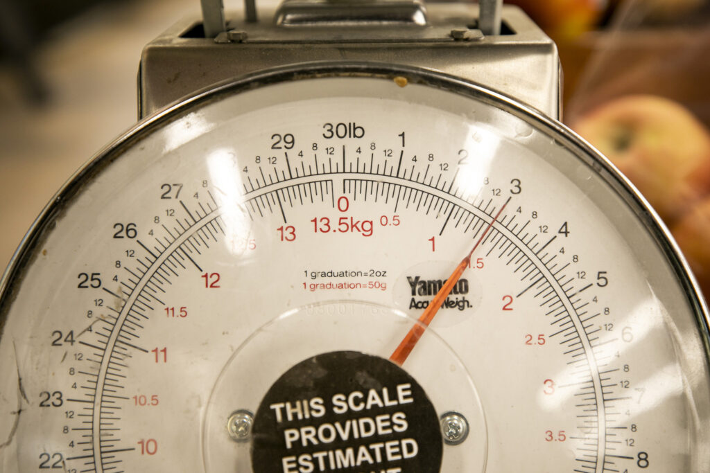 Vegetable Scale In Grocery Story Young Woman Shopper In Supermarket