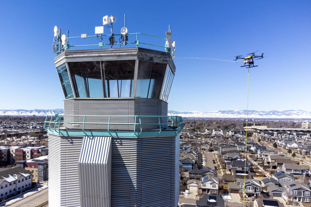We saw a drone wash the old Stapleton Airport air traffic control tower ...